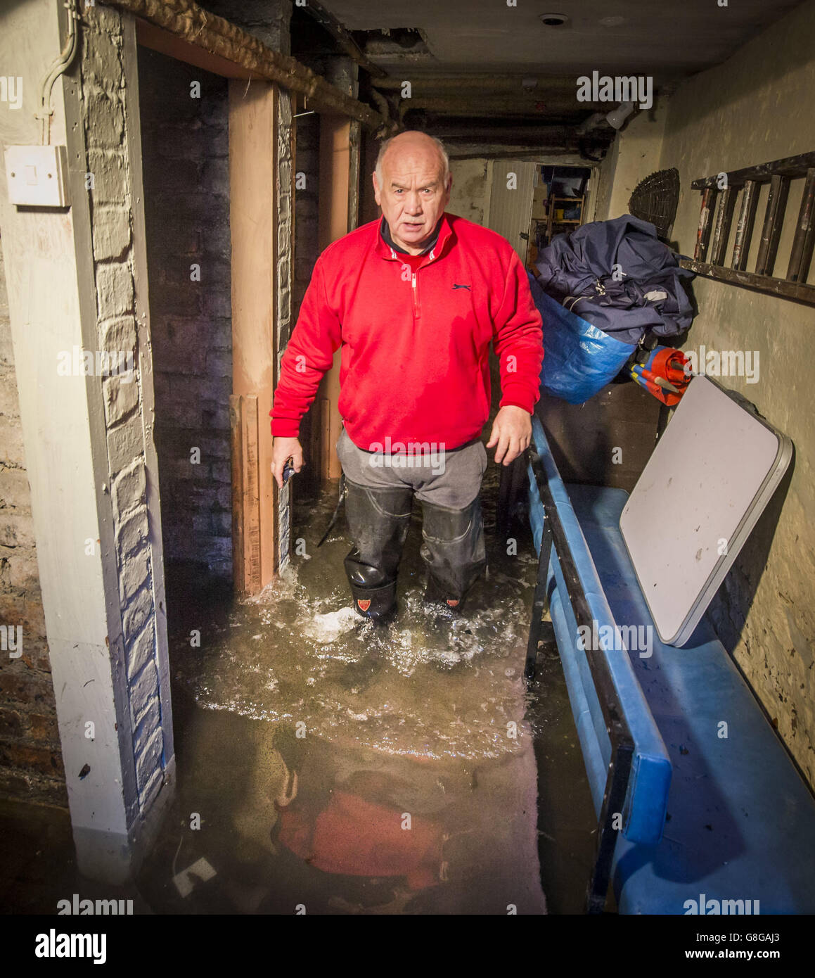 Jim Renwick walks through his flooded cellar in Hawick, Scotland, after ...