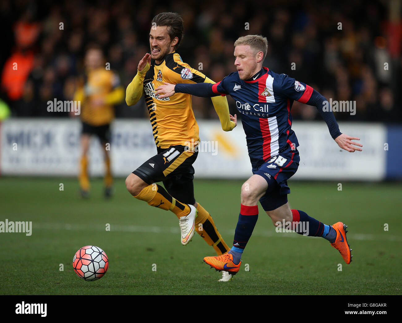 Cambridge United Harrison Dunk and Doncaster Rovers Craig Alcock battle ...