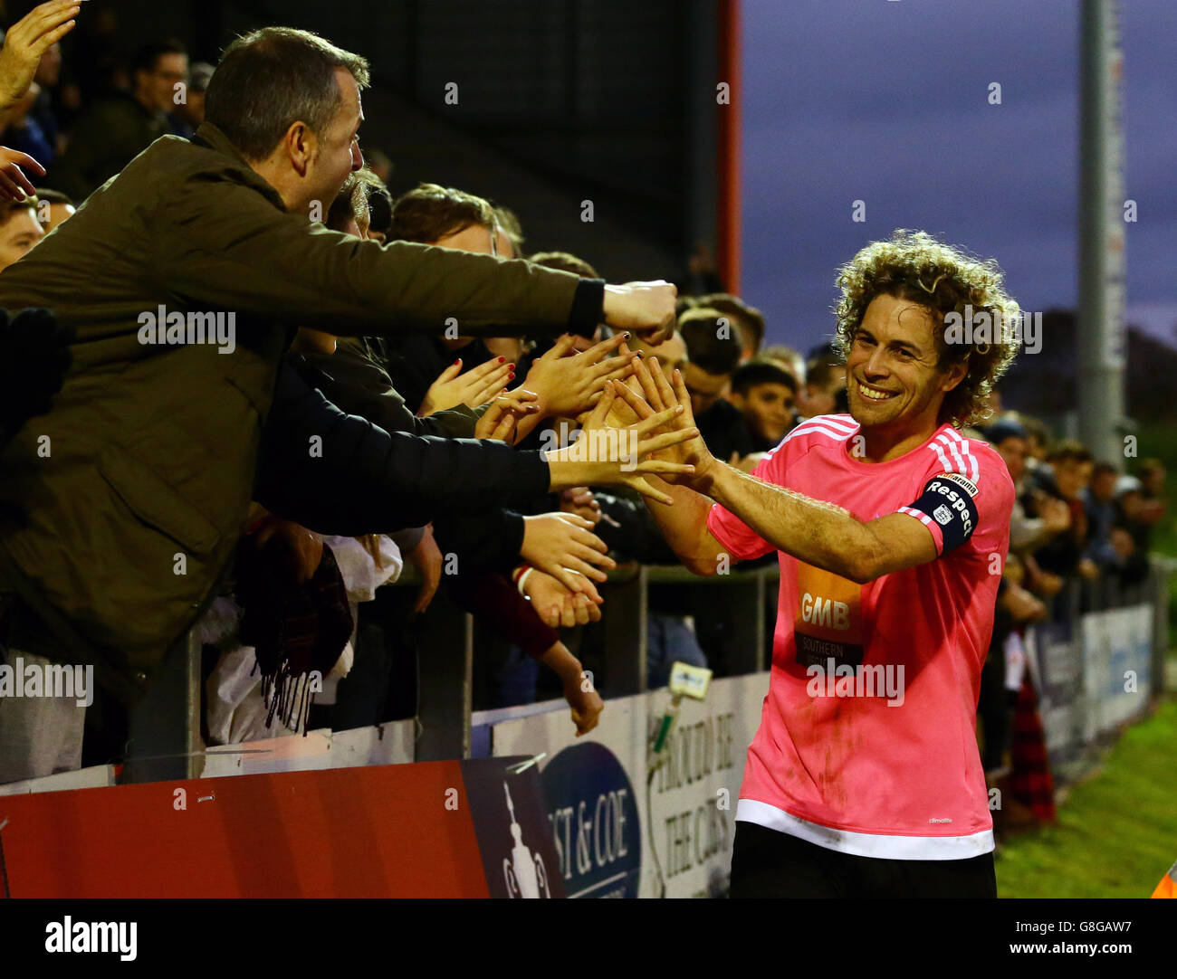 Whitehawk's Sergio Torres celebrates with fans as he leaves the field ...