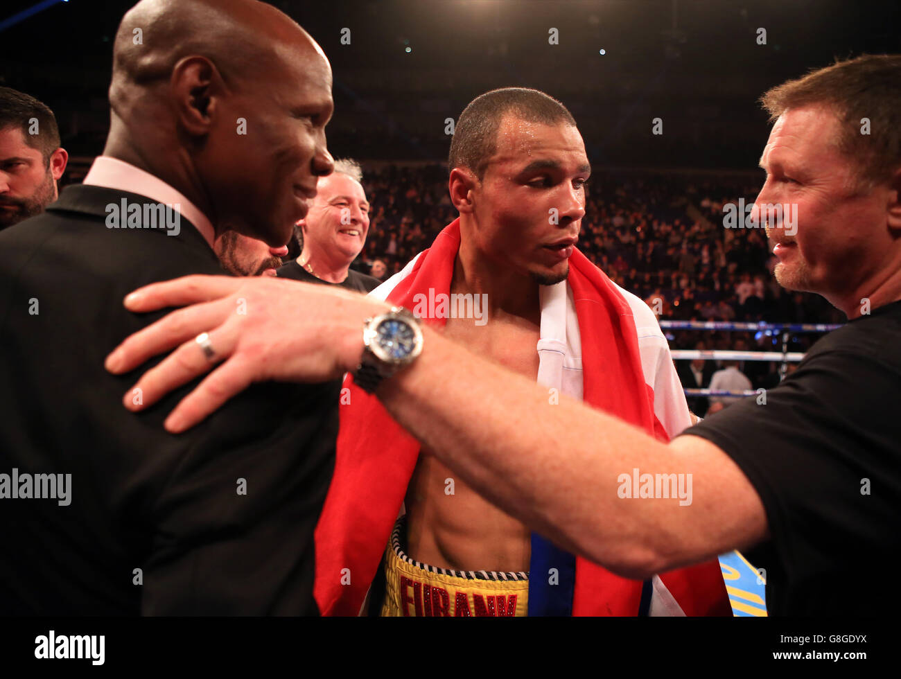 Chris Eubank Jr talks to Steve Collins (right) as he celebrates victory ...