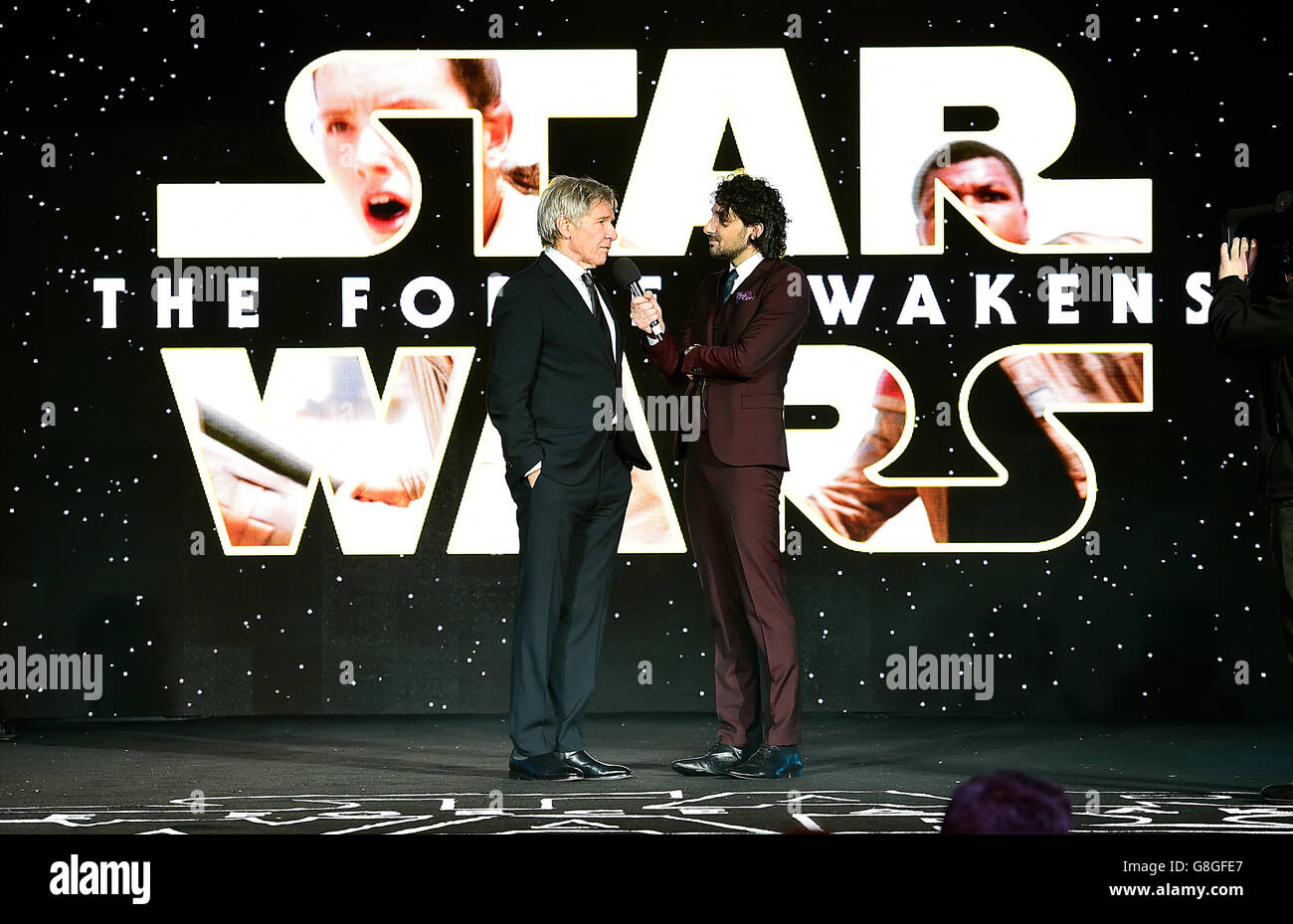 Harrison Ford and Alex Zane on stage during the Star Wars: The Force ...