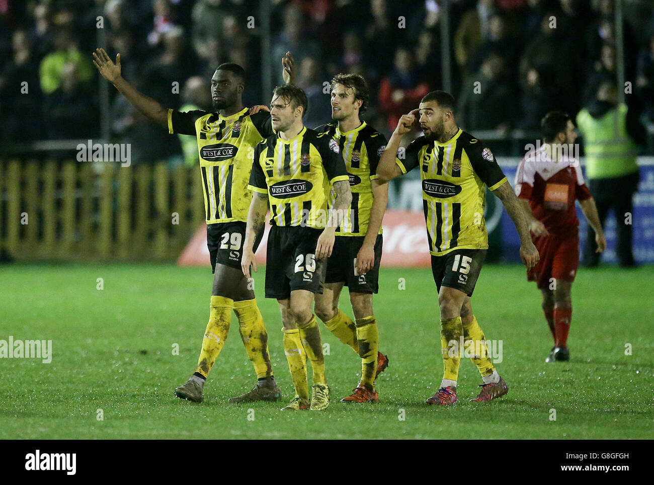 Dagenham and Redbridge's Ayo Obileye (left) celebrates scoring his side ...