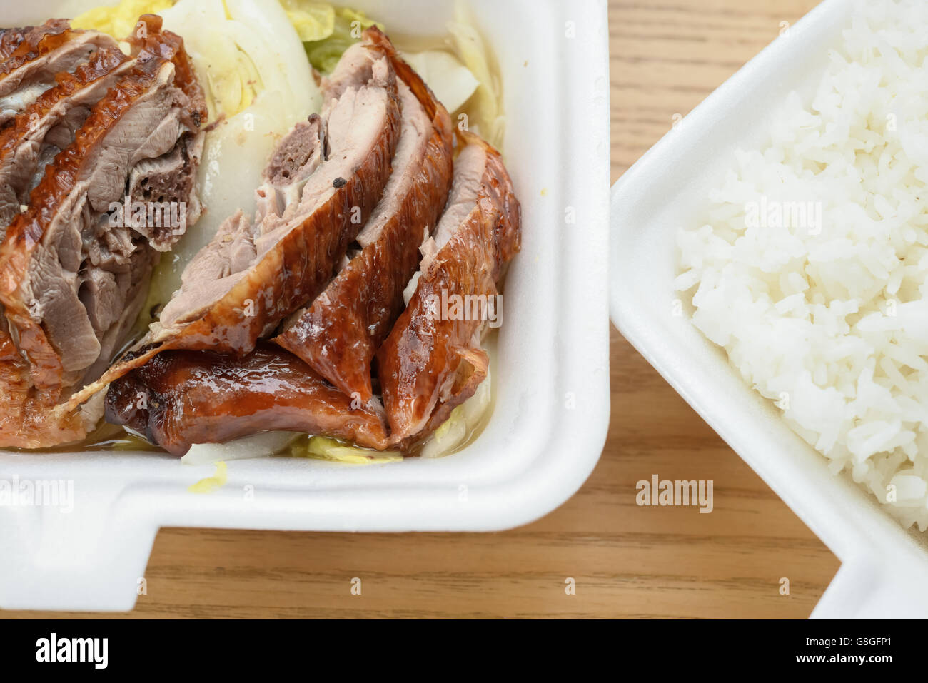 lunch box of roasted duck and another box of rice on table Stock Photo ...