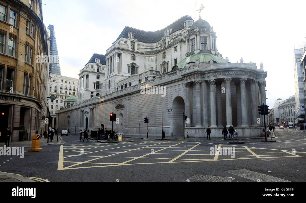 A handful of pedestrians pass through the normally bustling junction of ...
