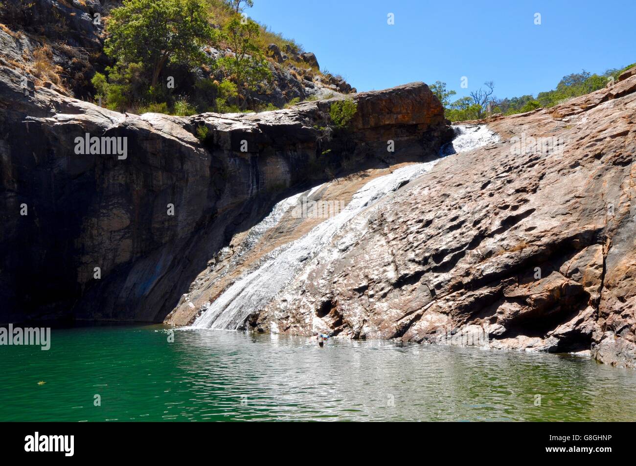 Remote Serpentine Falls with granite rock face, waterfall and native ...
