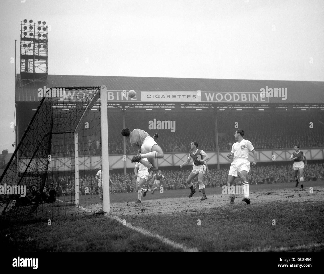 Peterborough United's Terry Bly (c) watches as Portsmouth goalkeeper ...