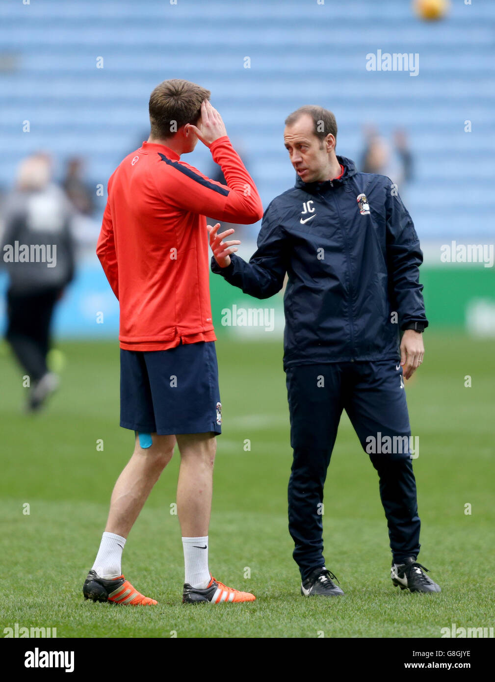 Coventry City first team coach Jamie Clapham (right) during the warm up ...