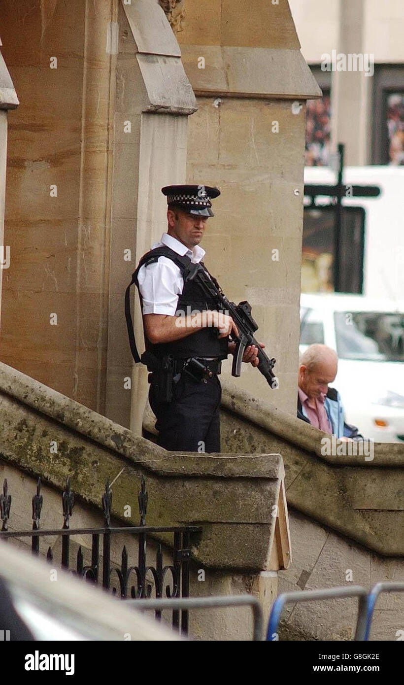 An armed police officer stands hi-res stock photography and images - Alamy