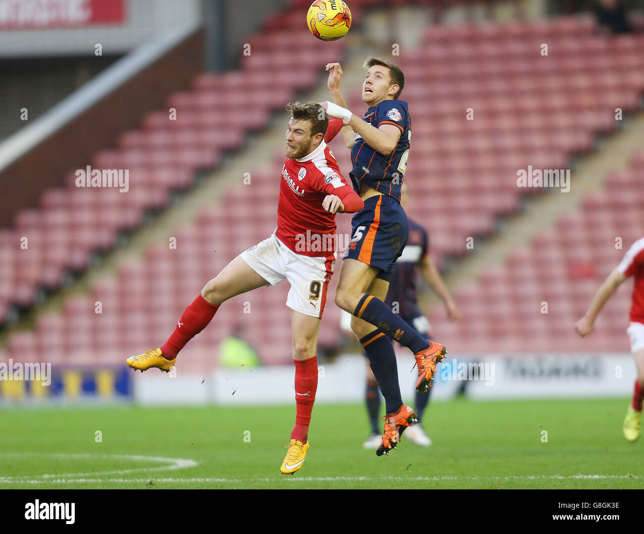 Barnsley's Sam Winnall (left) and Blackpool's Will Aimson (right Stock ...