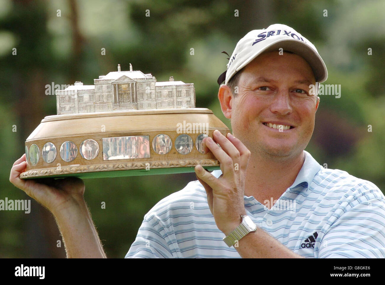 South Africa's Tim Clark celebrates with the trophy after winning Stock ...