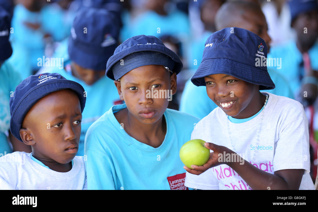 Children sit in the audience during the official opening of the ...