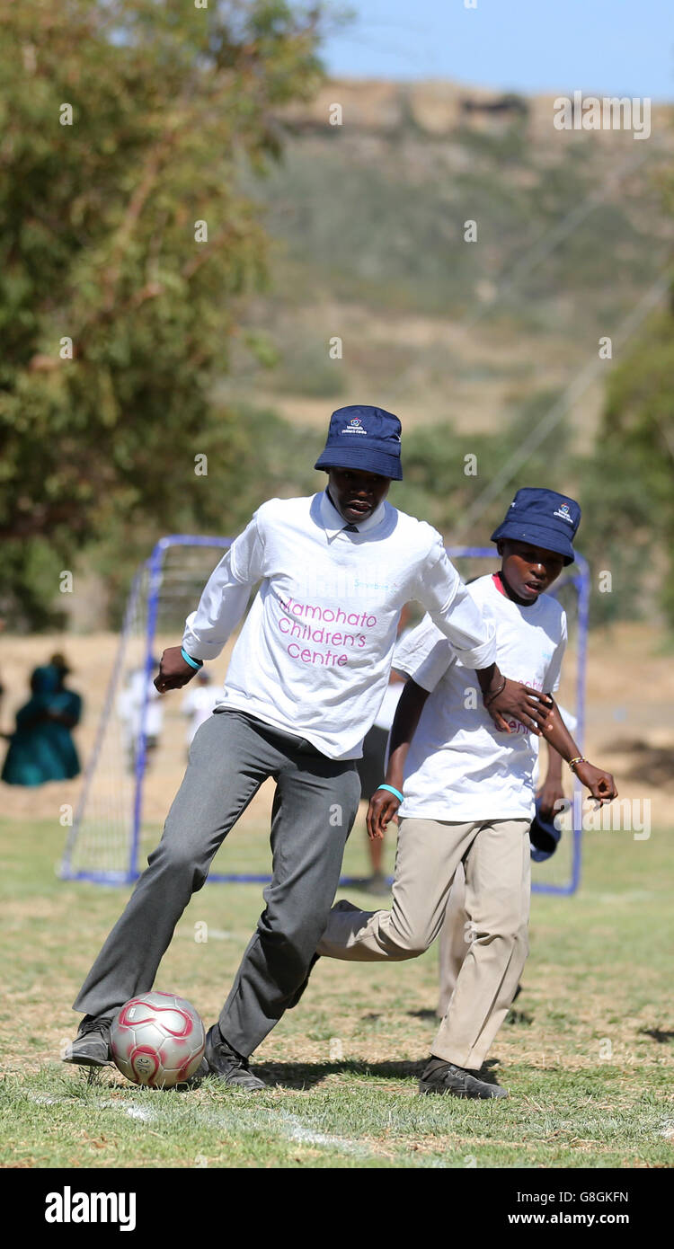 Children play football during a the official opening of the Sentebale ...