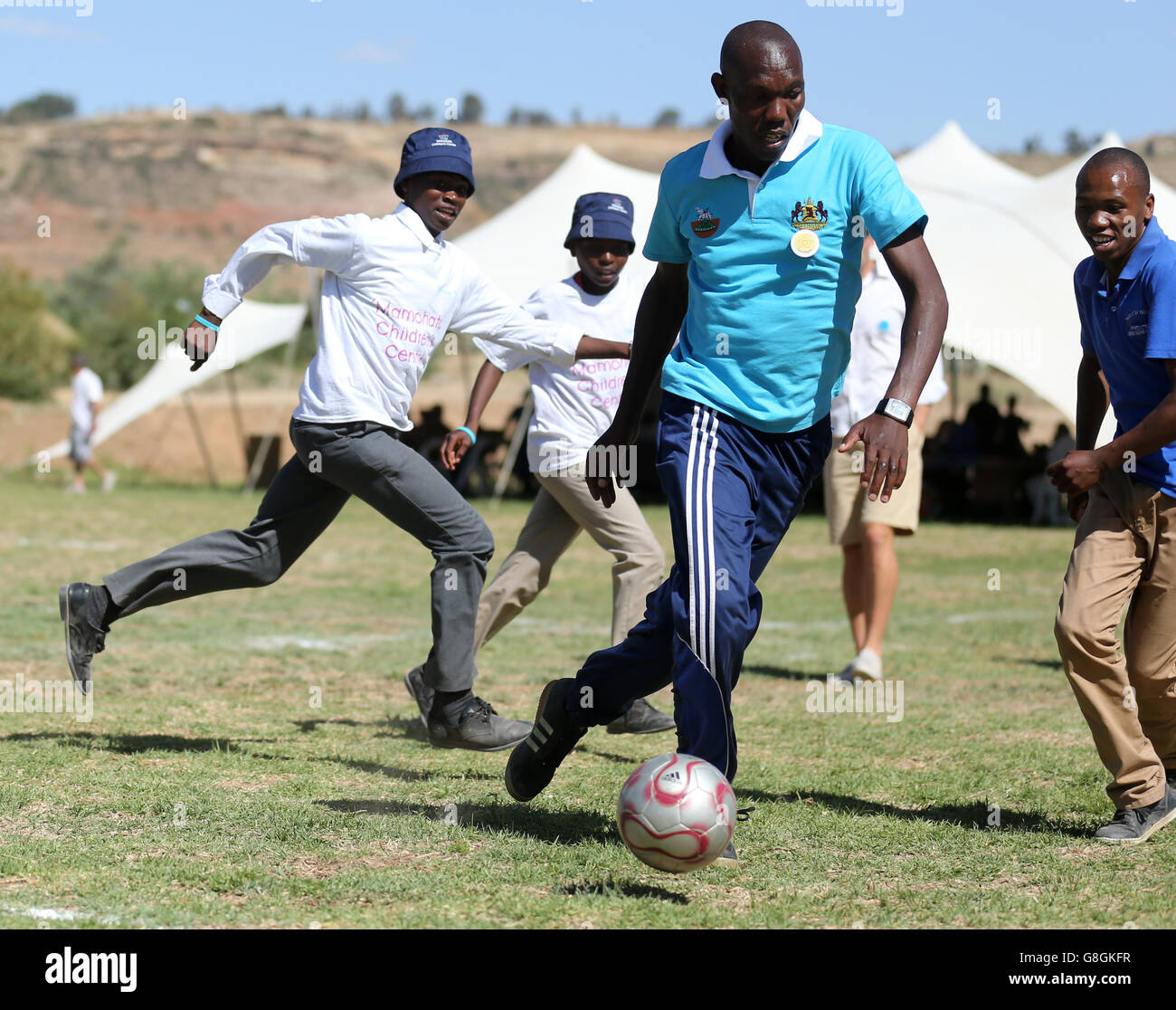 Children play football during a the official opening of the Sentebale ...