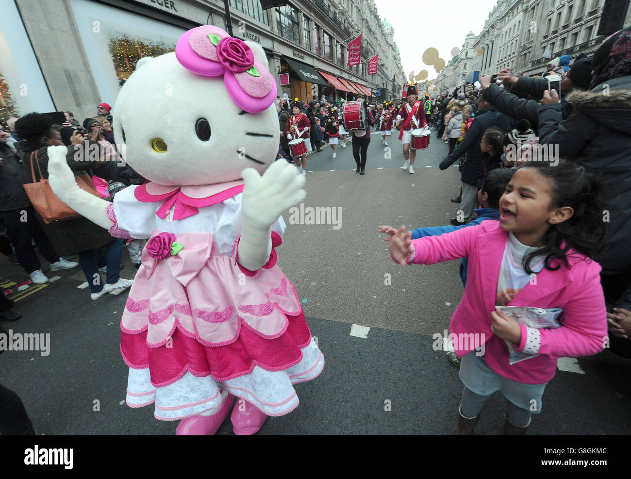 A child reacts to a Hello Kitty character during Hamley's Christmas Toy ...