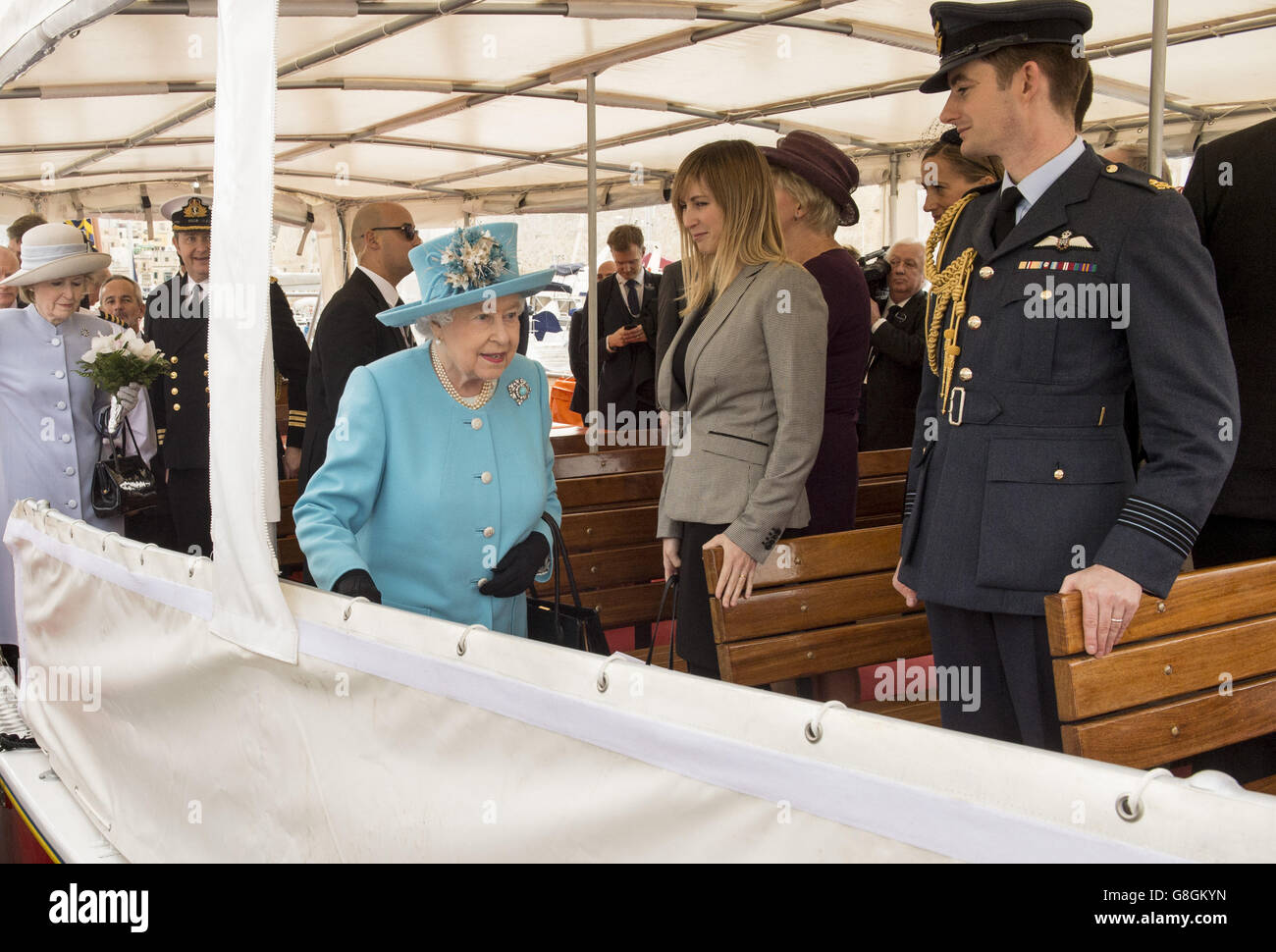 Queen Elizabeth II embarks on a boat for a trip across Valletta Harbour ...