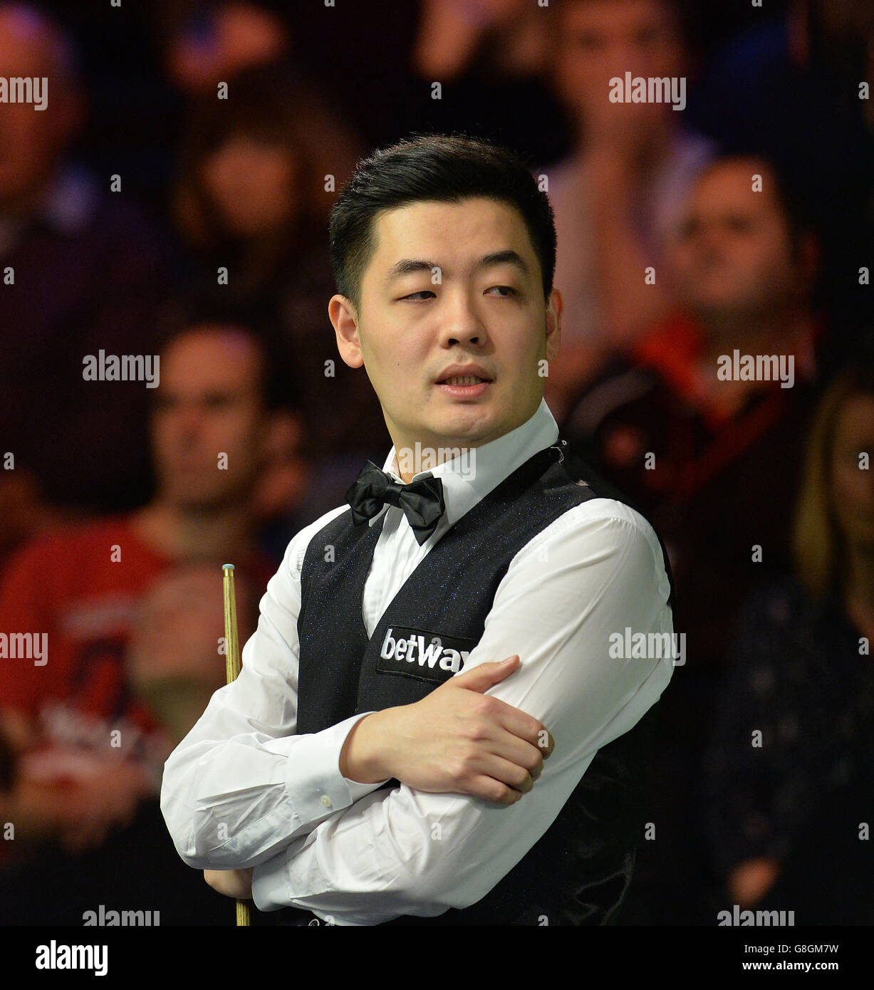 Tian Pengfei looks on in his second round match against John Higgins ...
