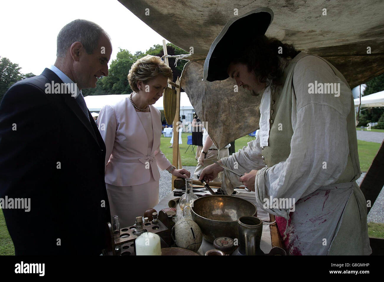 President Mary McAleese and her husband Martin (left) stand at a living ...