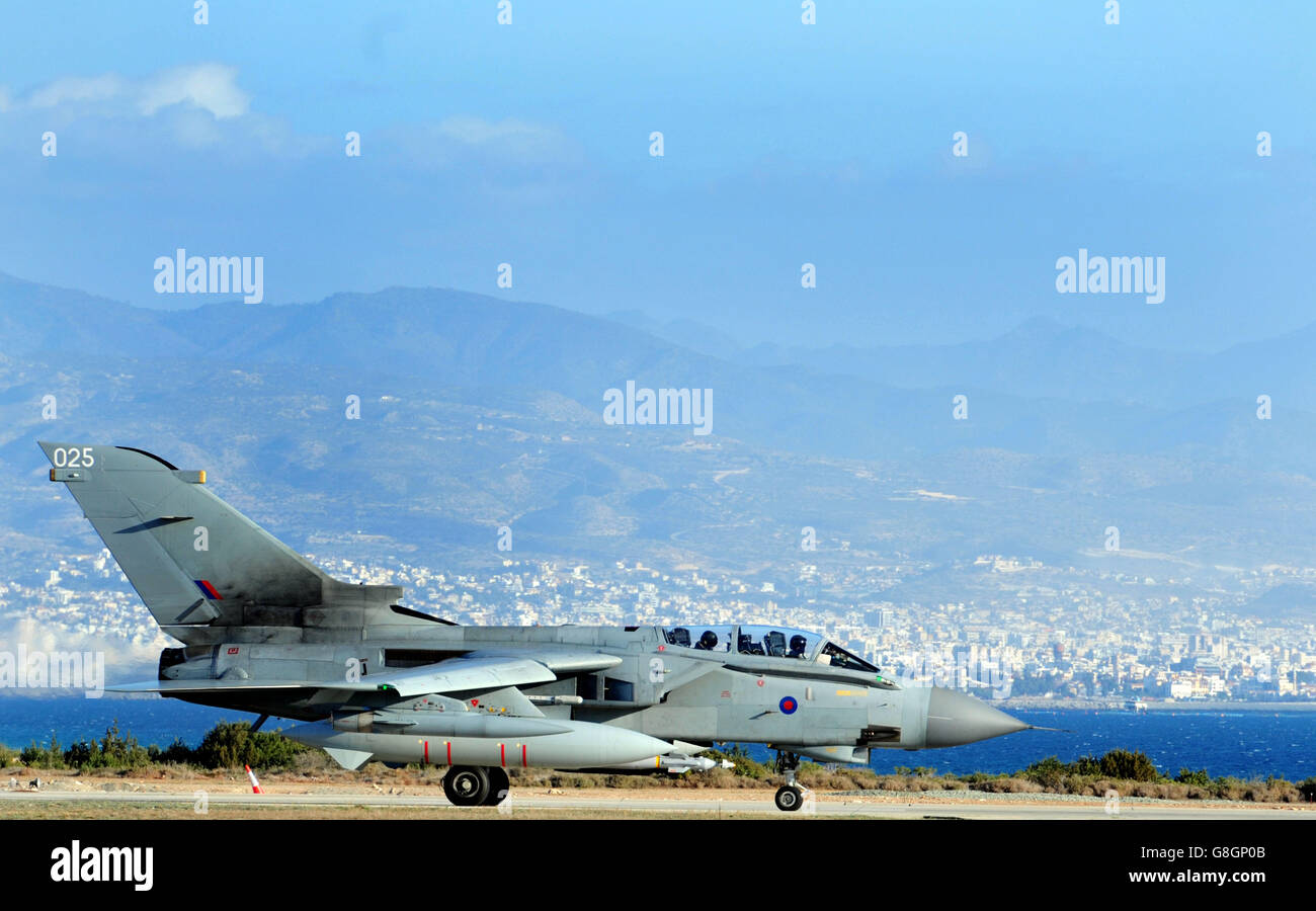 The pilot and co-pilot sit in the cockpit of an RAF Tornado GR4 as it ...