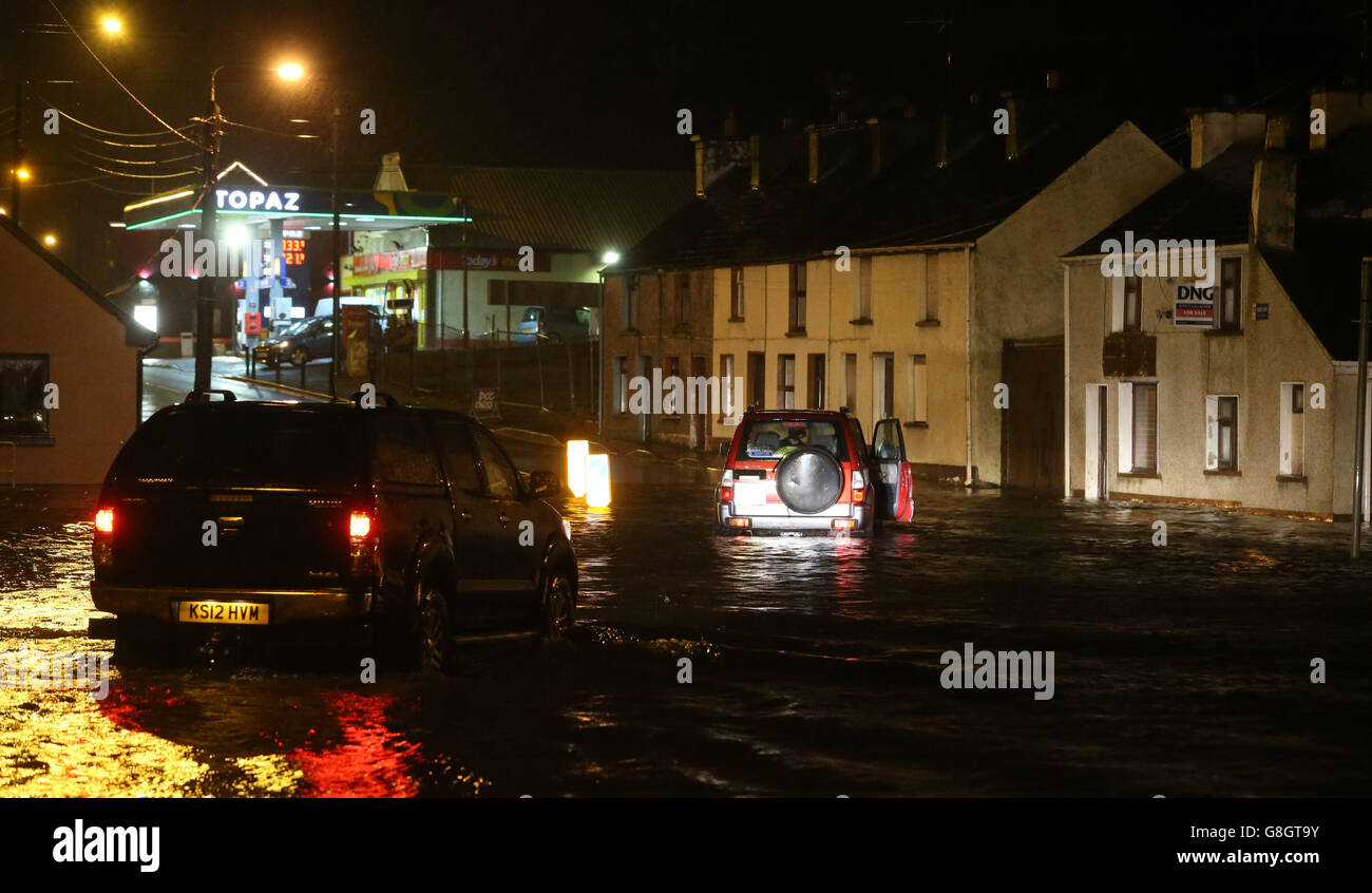 People make their way though floods in the Castlefin area of Donegal ...