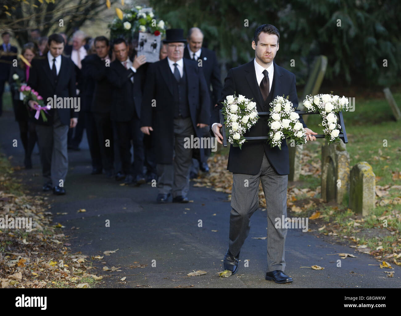 Frankie Dettori and other jockey's carry out the coffin after the ...