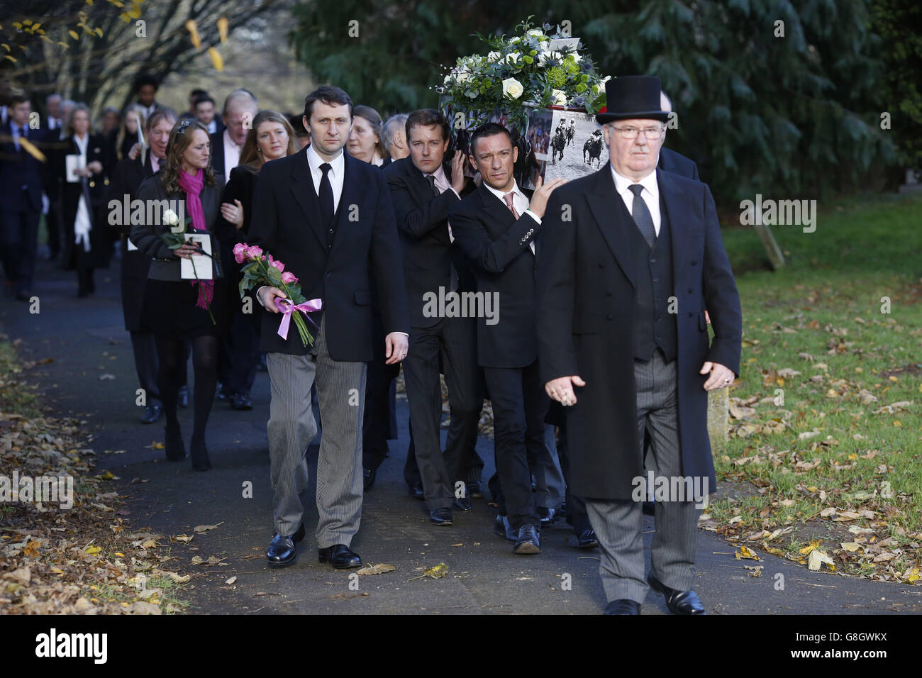 Frankie Dettori and other jockey's carry out the coffin after the ...