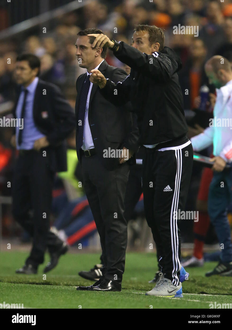 Valencia manager gary neville left and his assistant hi-res stock ...
