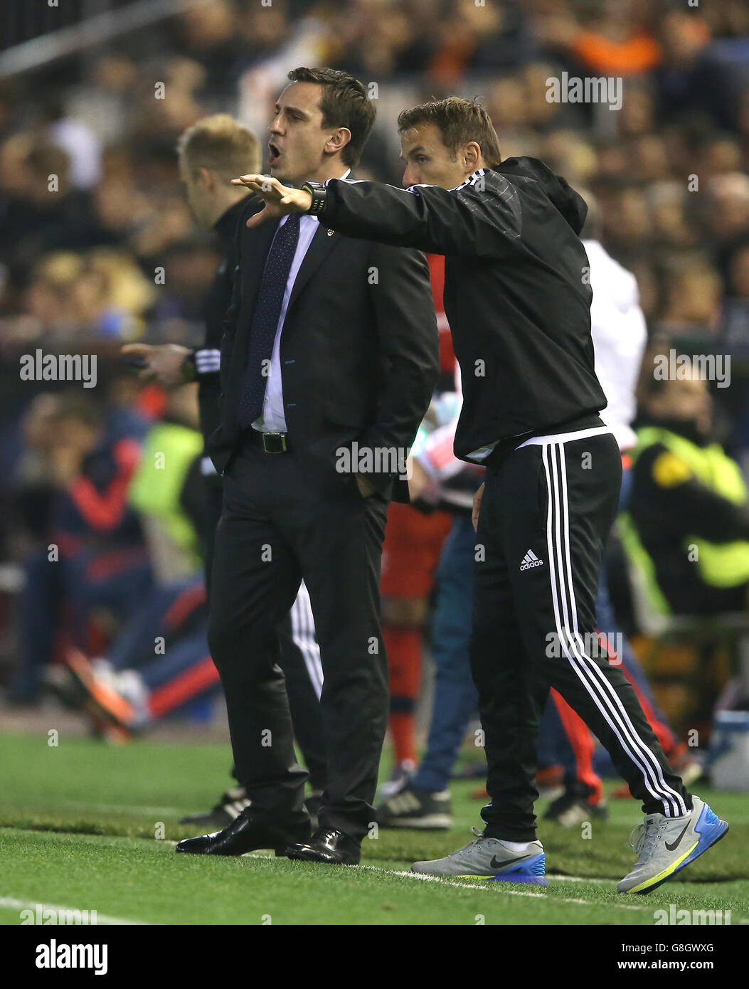Valencia manager gary neville left and his assistant hi-res stock ...