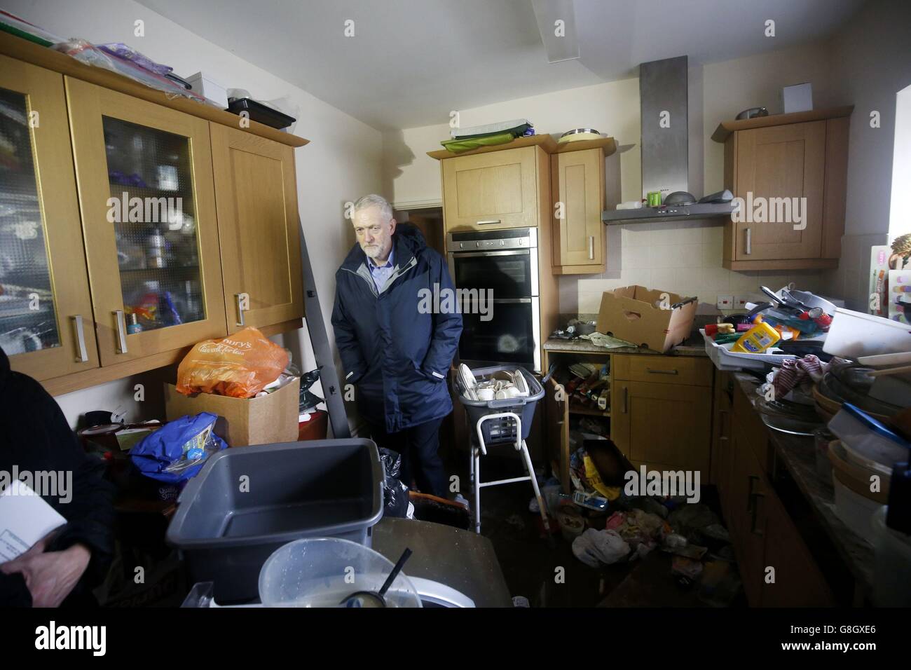 Labour leader Jeremy Corbyn visits a flood damaged home in Cockermouth ...