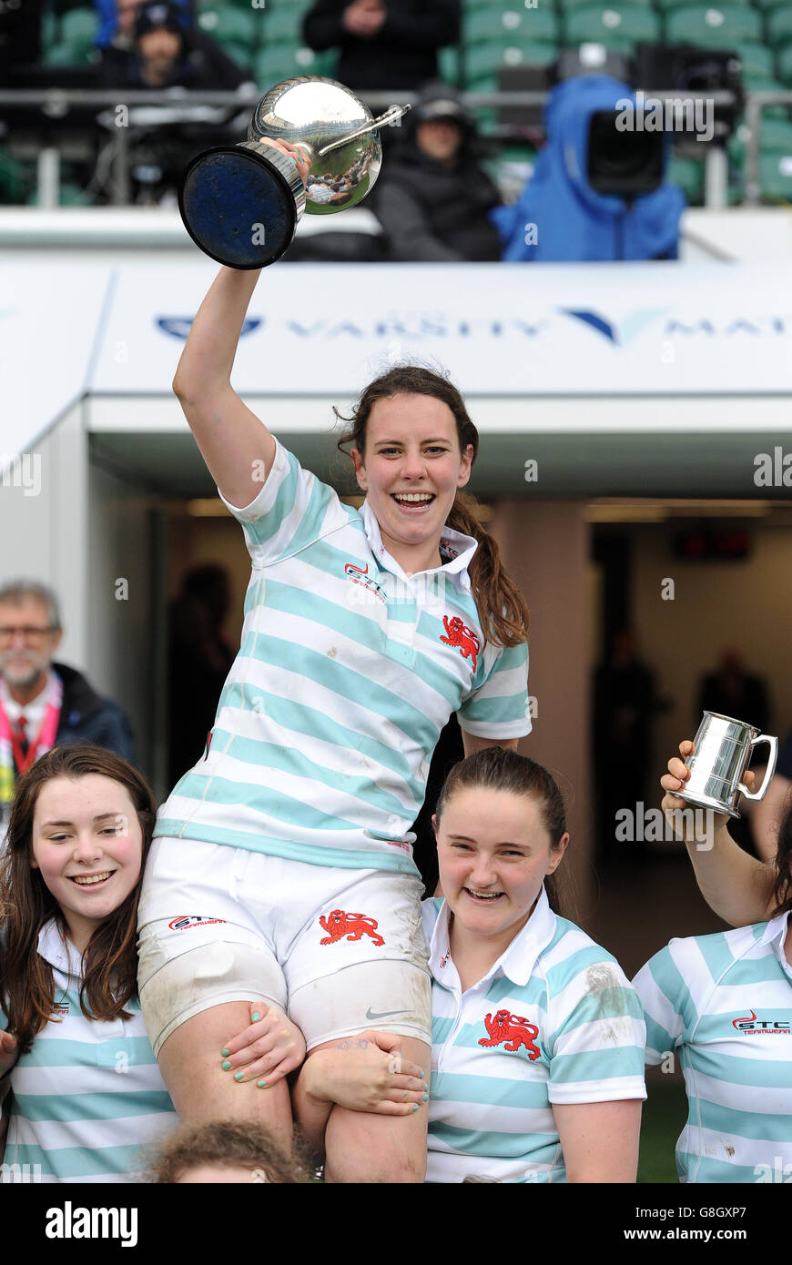 Cambridge University's captain Nikki Weckman is held up by her team ...