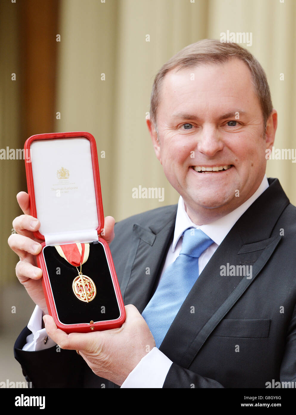 Sir Gary Verity holds his insignia of Knighthood which was presented by ...