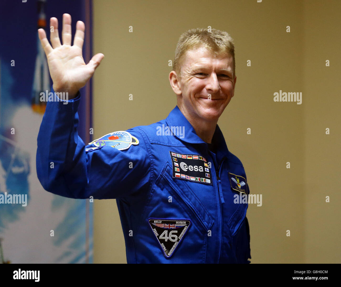British astronaut Tim Peake waves as he leaves the crew's news ...