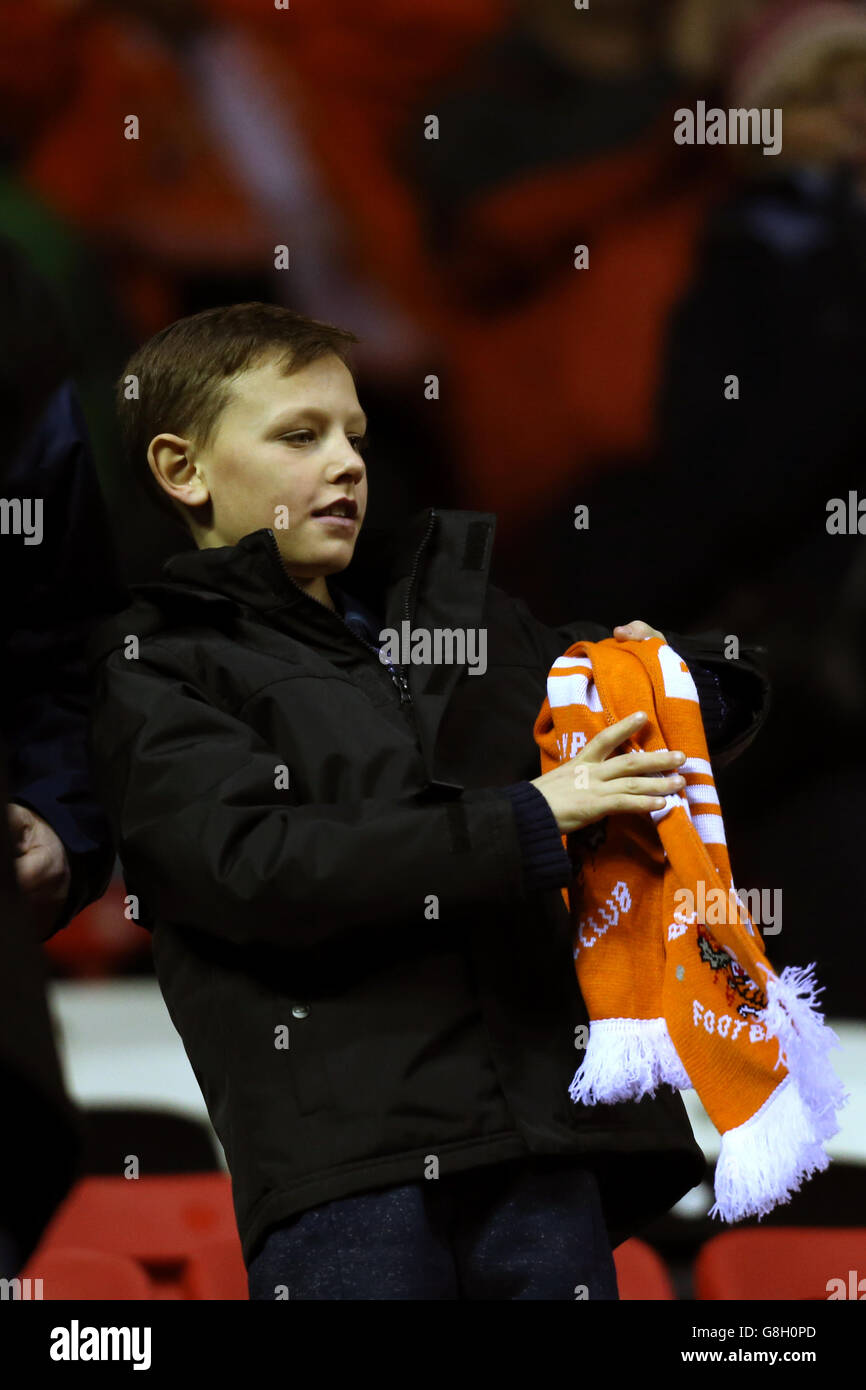 A young Blackpool supporter cheers on her side from the sides Stock ...