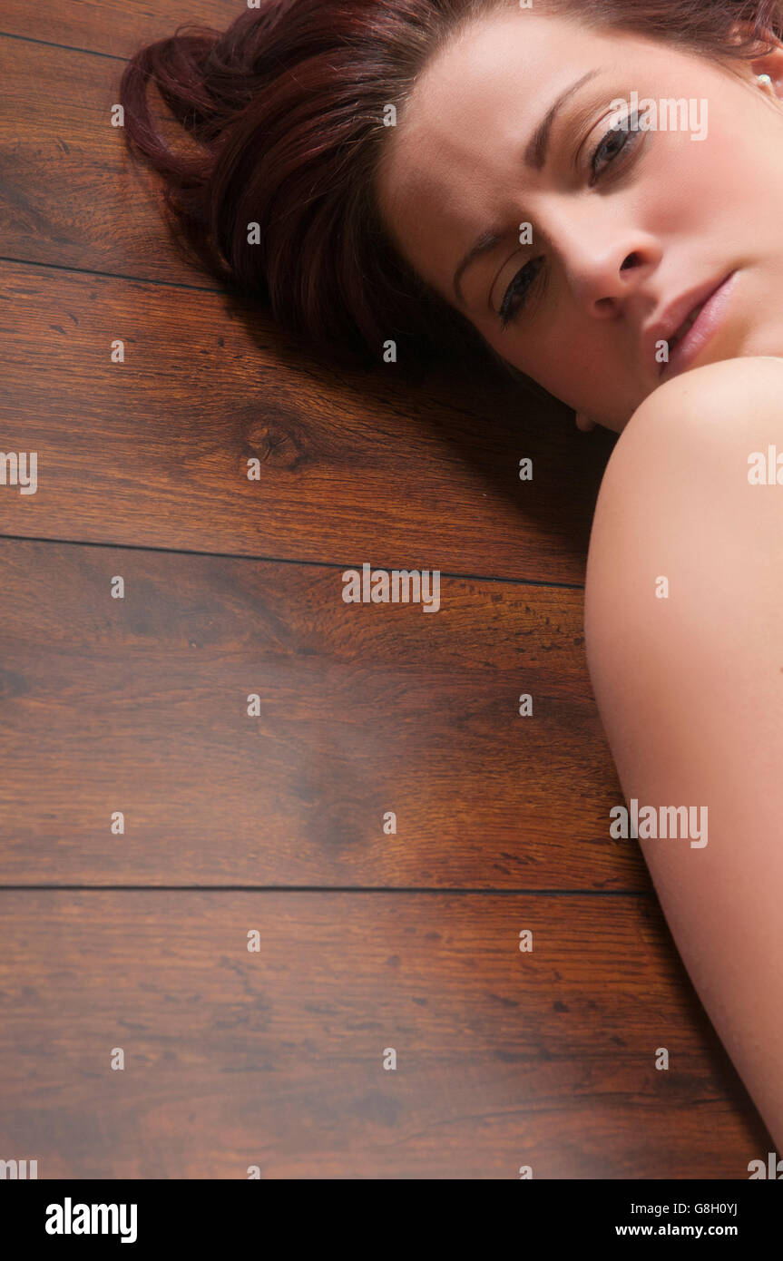 Depressed woman laying on floor hi-res stock photography and images - Alamy