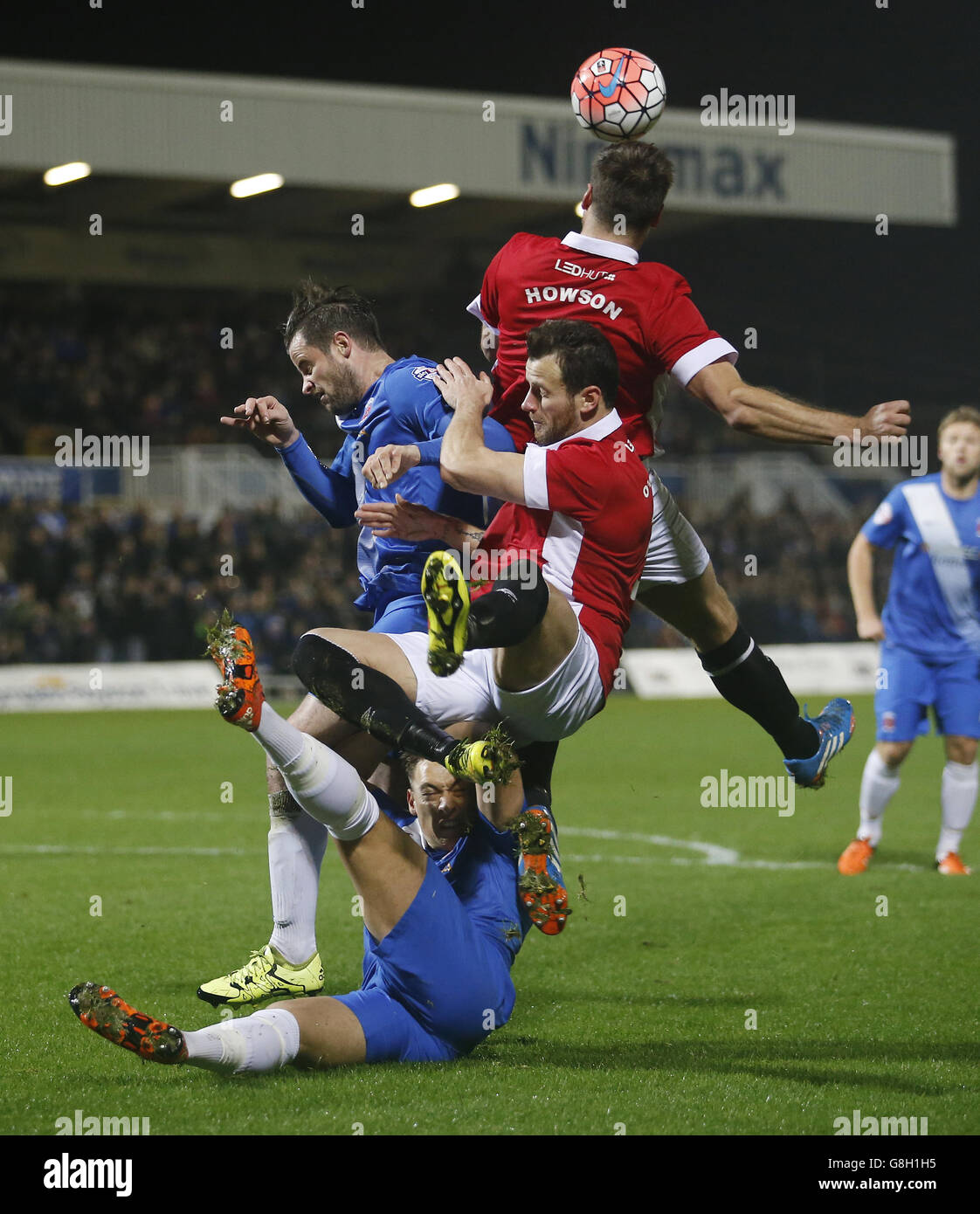 Salford's Steve Howson heads the ball with Stephen O'Hallorran (centre ...