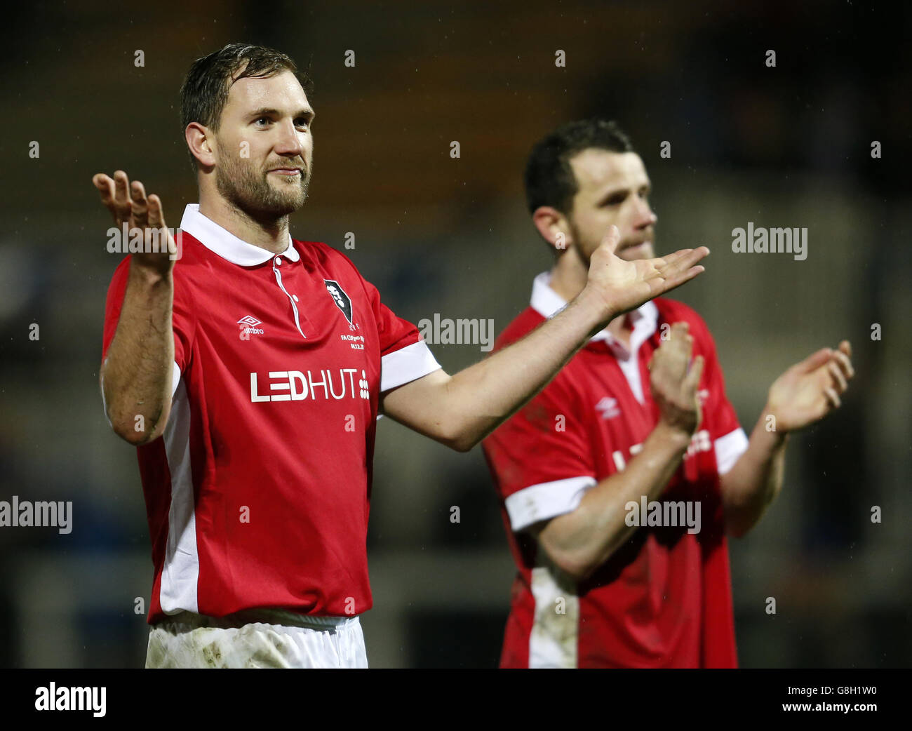 Salford City's Steve Howson (left) thanks the traveling fans after ...
