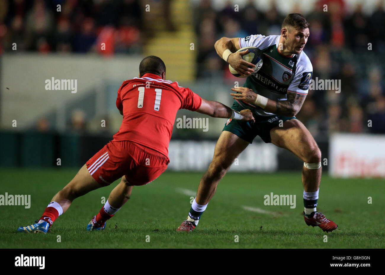 Leicester Tigers' Adam Thompstone and Munster's Simon Zebo (11) during ...