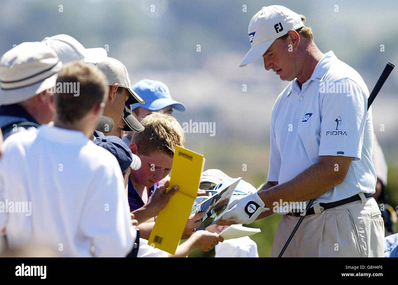 South Africa's Ernie Els signs autographs on the 5th tee during ...