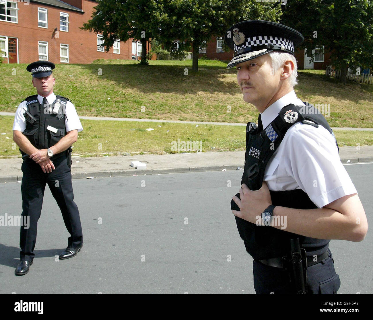 Chief Constable for West Yorkshire Police Colin Cramphorn (right) talks ...
