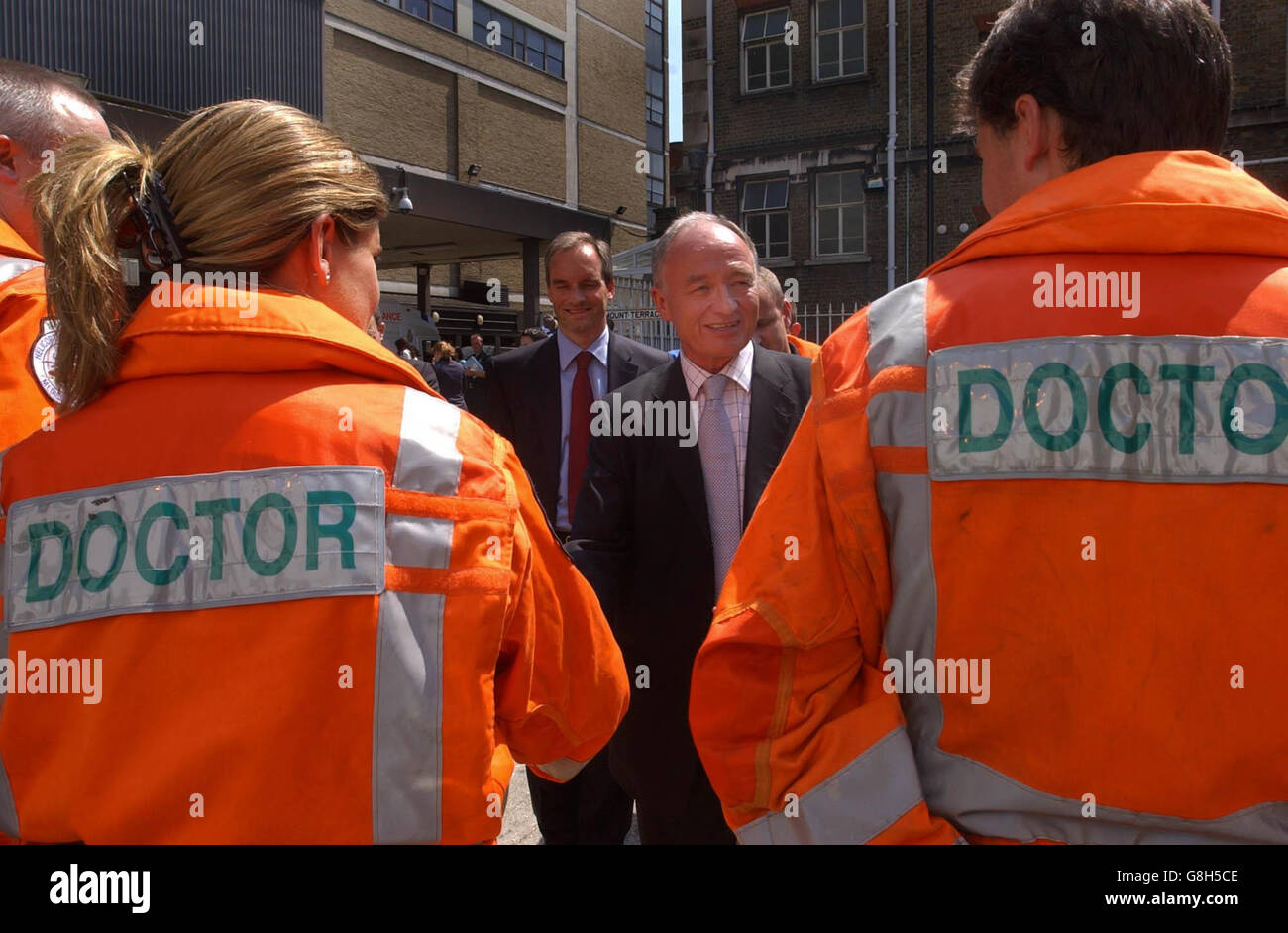 London Mayor Ken Livingstone speaks to emergency services staff on a ...