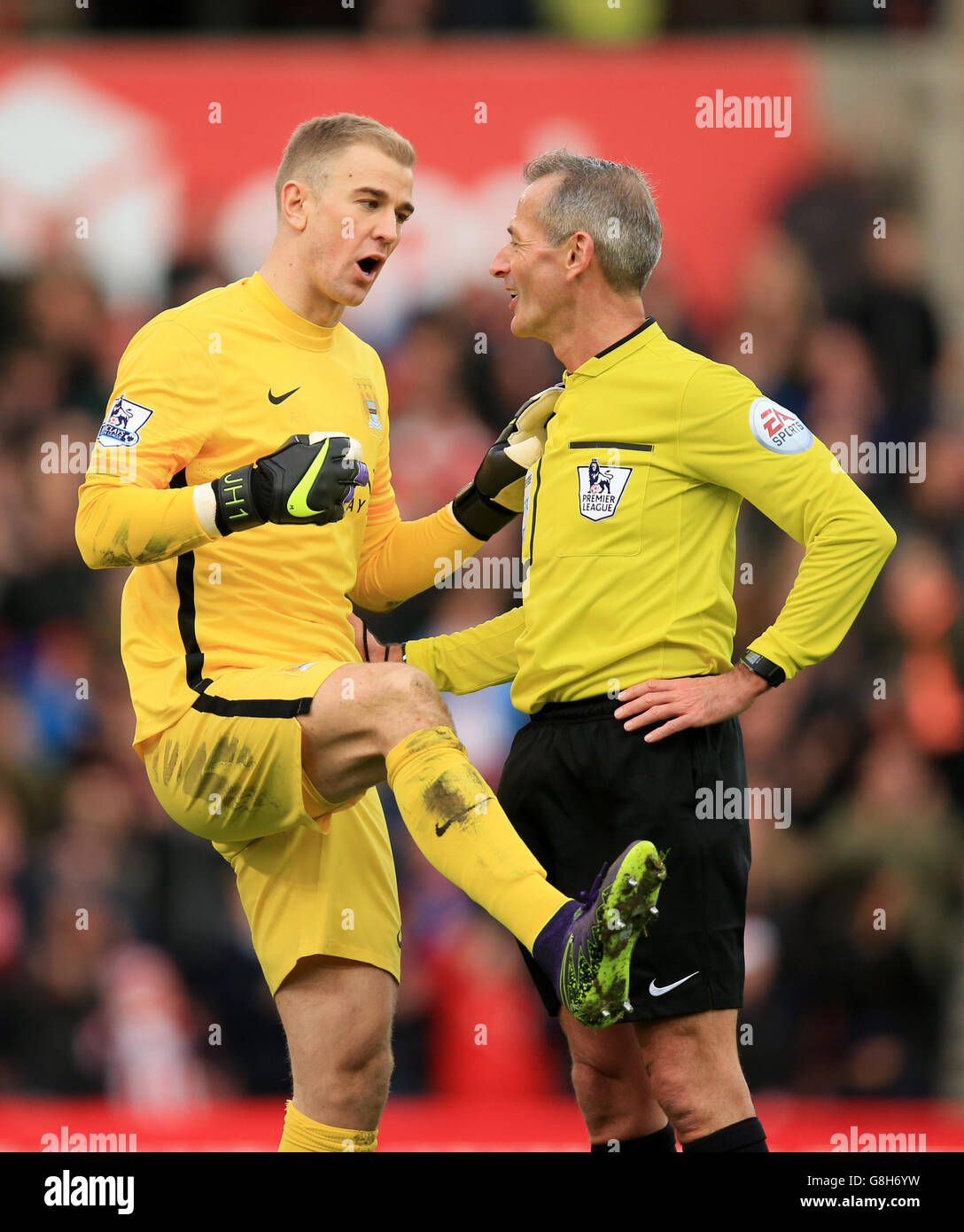 Manchester City goalkeeper Joe Hart (left) complains to referee Martin ...