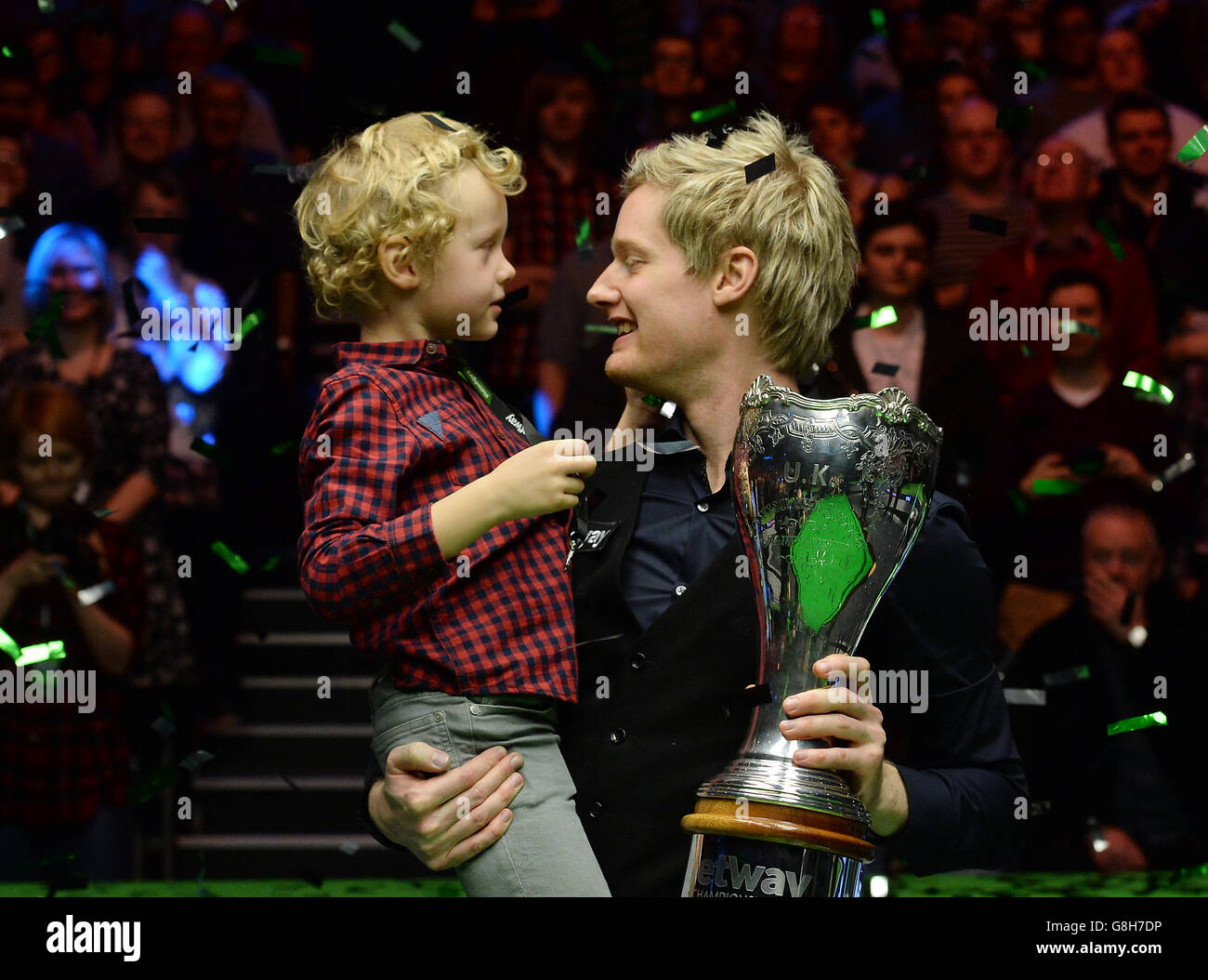 Neil Robertson celebrates with the trophy and his son Alexander after ...