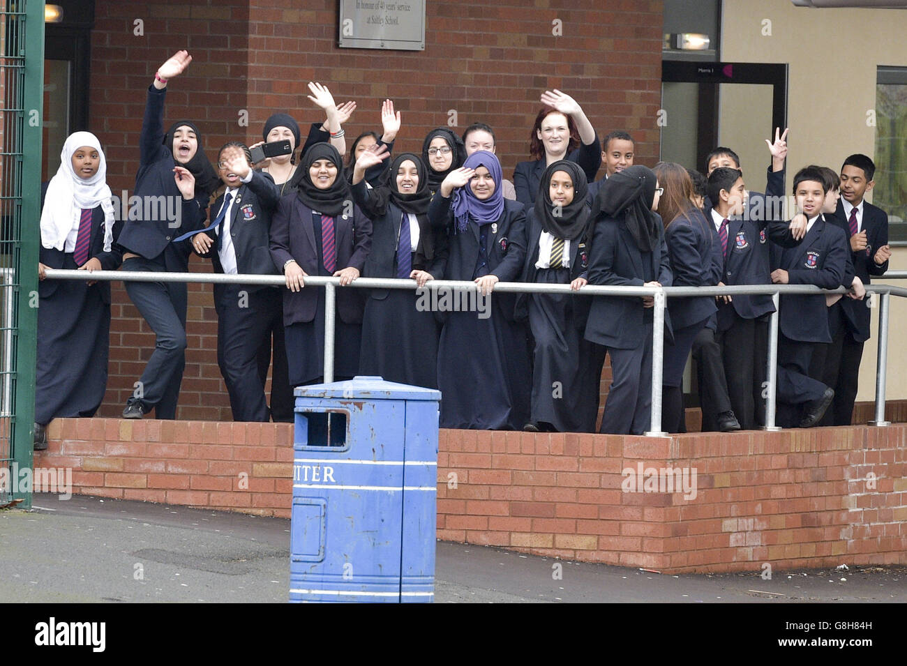 Pupils wave to the Duke of Cambridge as he visits Saltley Academy in ...