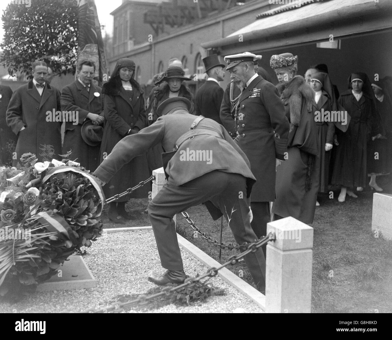 King George V and Queen Mary standing beside the grave of Nurse Cavell ...