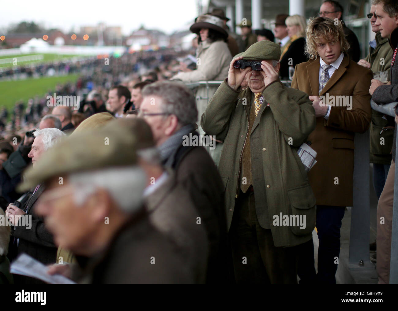 Cheltenham Races - The International - Day One. A racegoer looks on ...