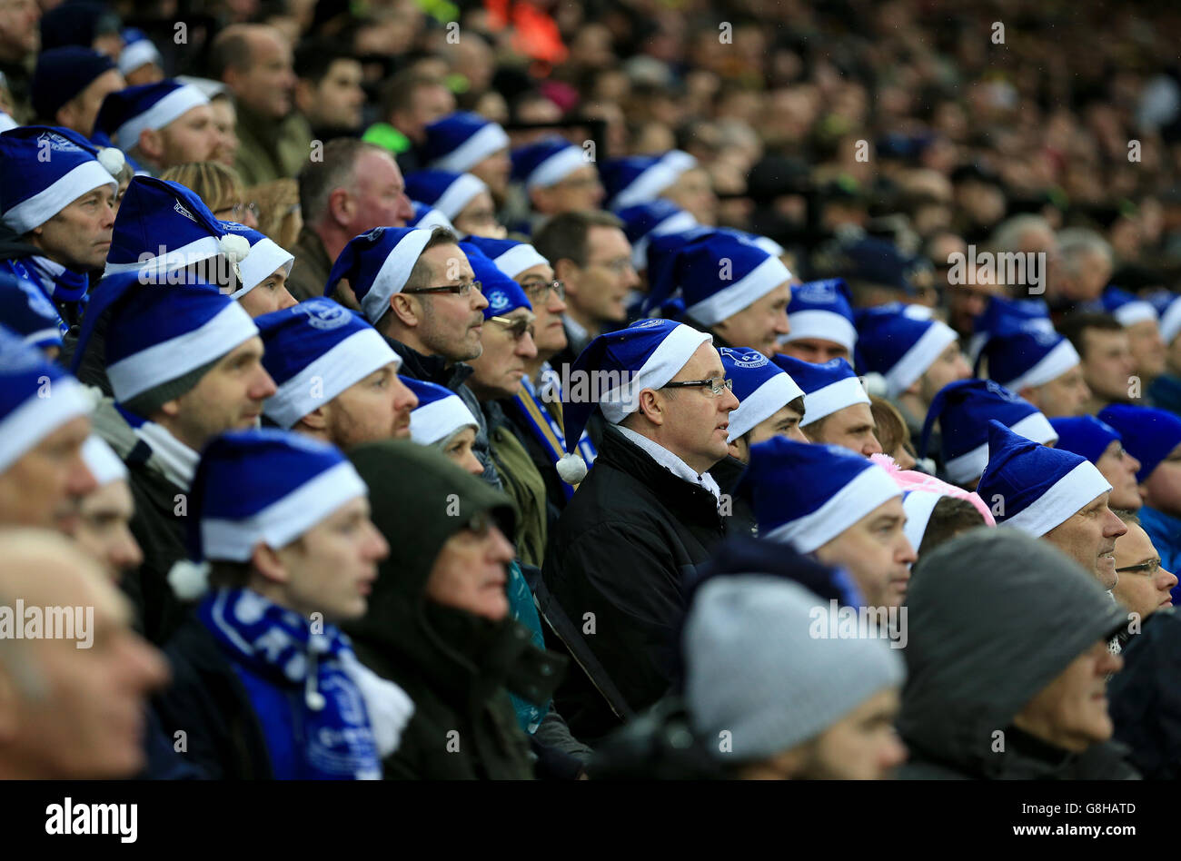 Everton fans wearing blue Santa Claus hats in the stands during the ...