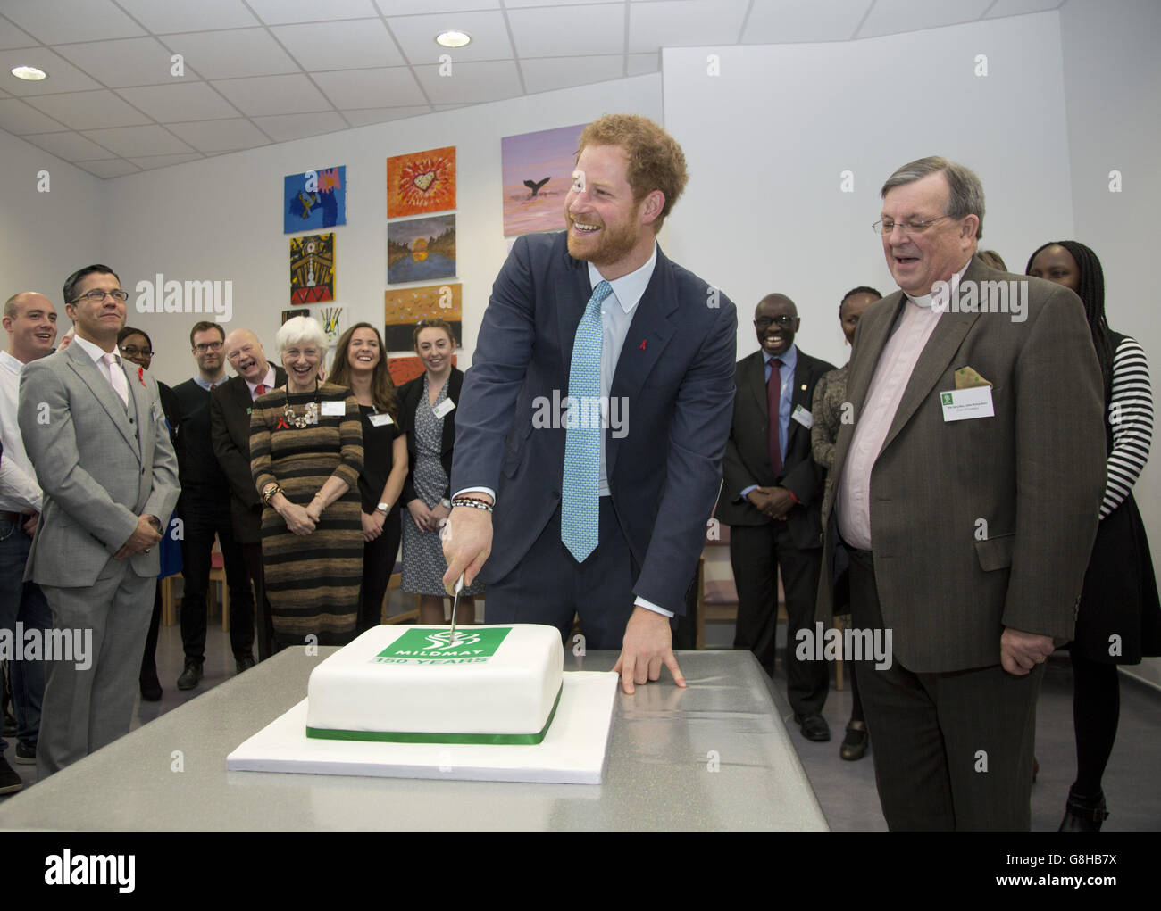 Prince Harry cuts a cake to celebrate the hospital's 150th year next ...