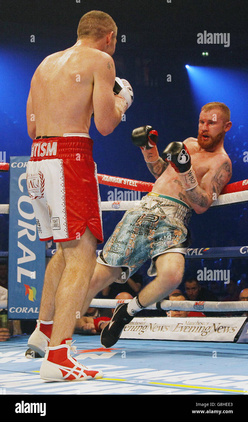 Liam Smith knocks down Jimmy Kelly (right) during their WBO World Super ...