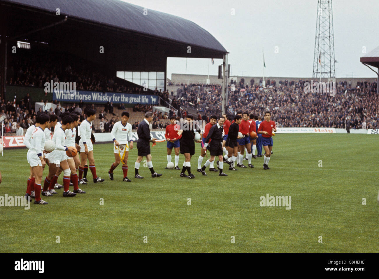 Referee Ali Kandil (c) invites the two teams to line up before the ...