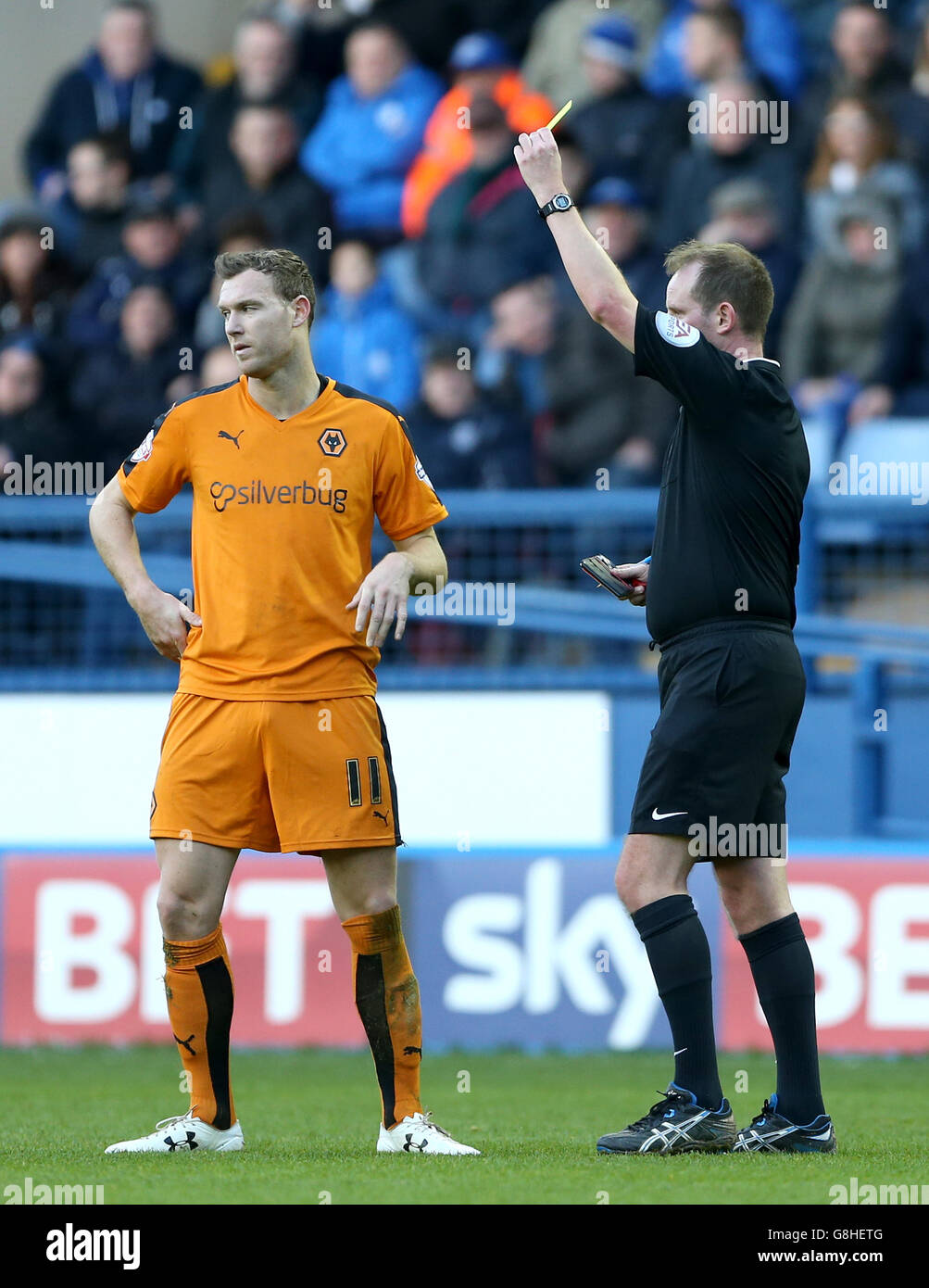 Wolverhampton Wanderers' Kevin McDonald receives a yellow card from ...