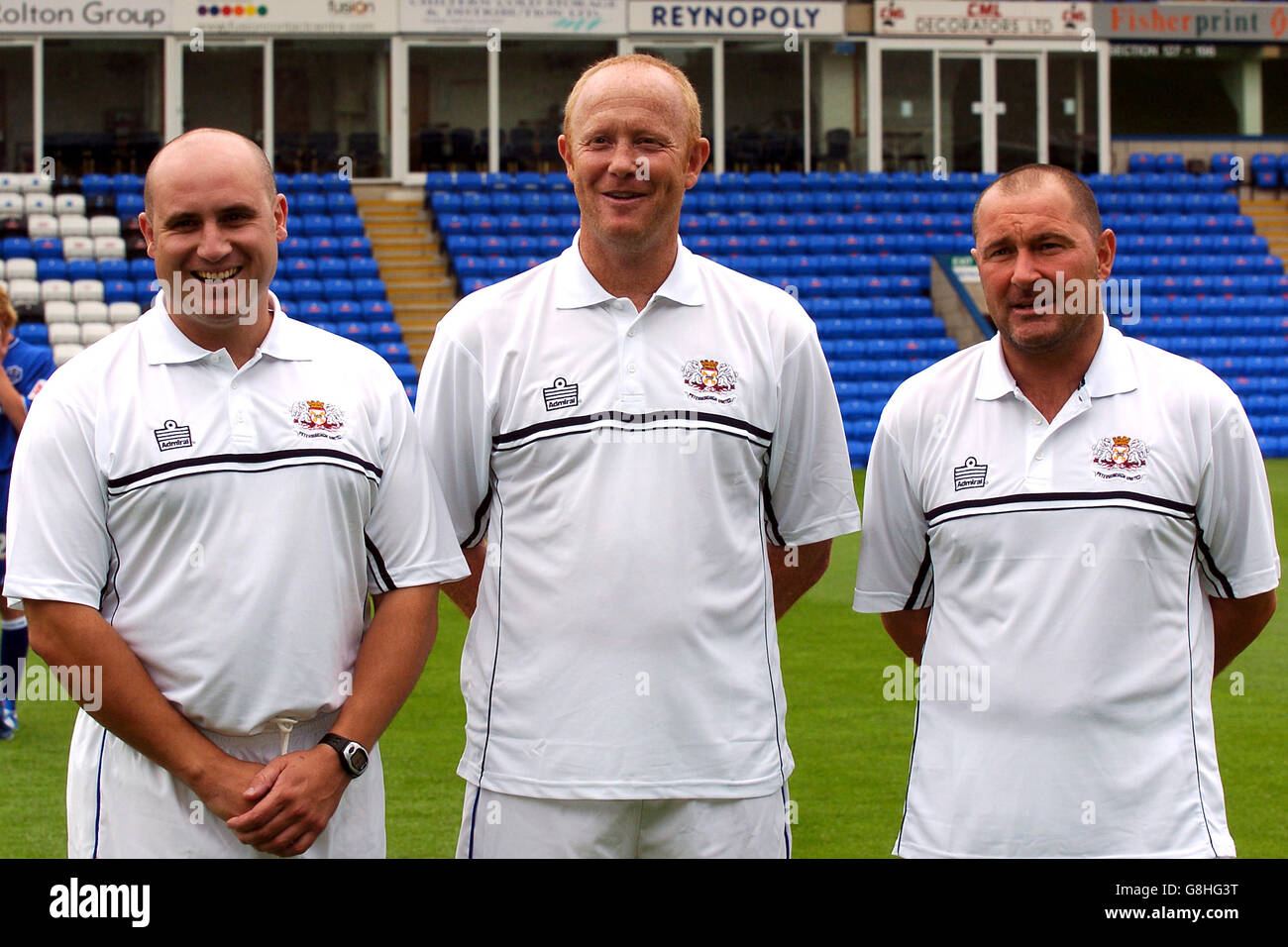 Peterborough United manager Mark Wright (c) flanked by his assistant ...